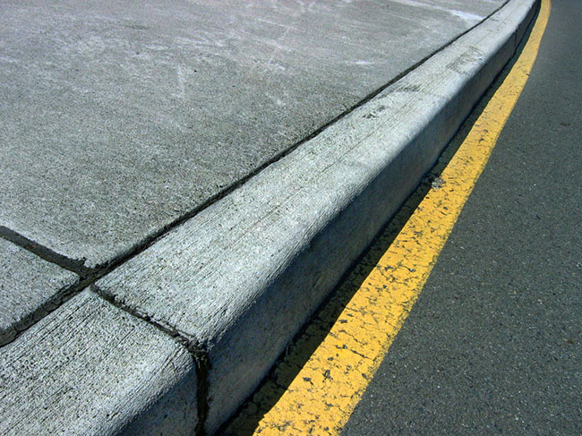 The Role of Concrete Curbing in Protecting Your Asphalt Investment